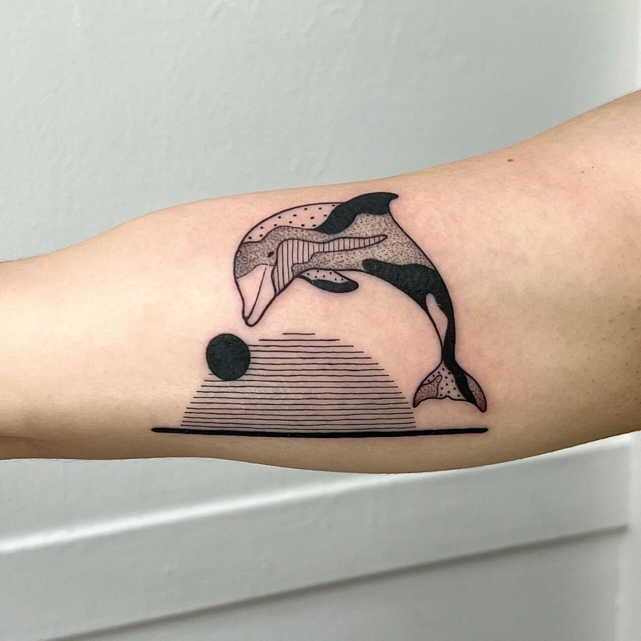 30 Delightful Dolphin Tattoo Ideas for Men & Women in 2024